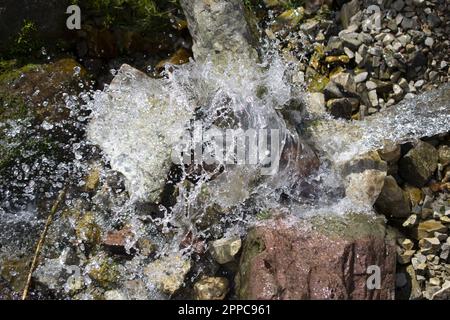 Splashes of spring water. Creek. Germany Stock Photo - Alamy