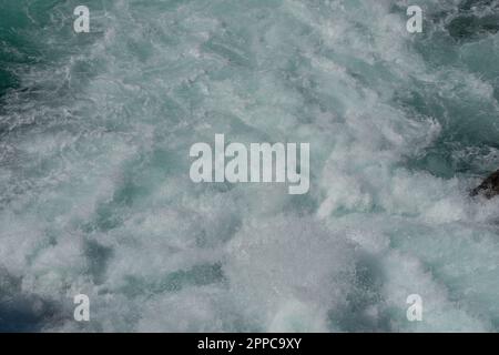 Swirling and surging river water below as the dam gates open at ...
