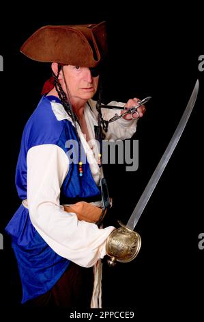 Pirate isolated on black with a cutless Stock Photo - Alamy