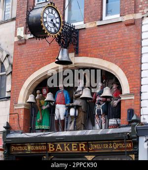 Mechanical chiming clock above Bakers, Edwardian shopfront. Jewellers ...
