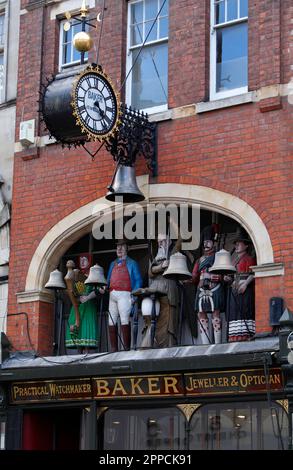 Mechanical chiming clock above Bakers, Edwardian shopfront. Jewellers ...