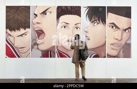 SHANGHAI, CHINA - APRIL 23, 2023 - A citizen looks at the poster of ...