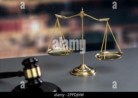 Shiny golden balanced scale and wooden gavel in law firm or lawyer ...