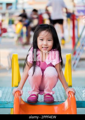 Kid at playground. Pretty face. Cute school child. Active vacation. Red ...