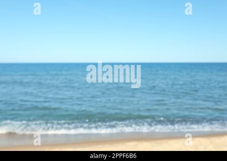 Blurred view of sandy beach near sea Stock Photo - Alamy