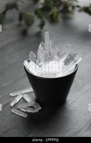 Menthol crystals in bowl on grey background Stock Photo - Alamy