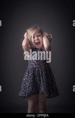 studio portrait of an angry child Stock Photo - Alamy