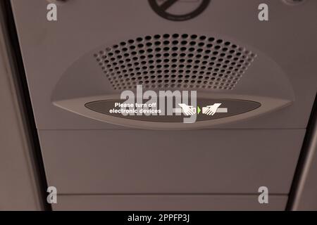 Plane cabin signs Stock Photo - Alamy
