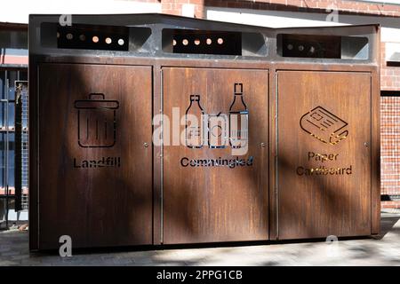 Garbage cans made of rusted Corten steel with separate bins for paper ...