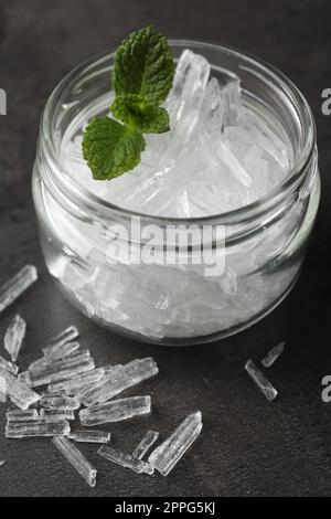 Menthol crystals and mint leaves on white background Stock Photo - Alamy