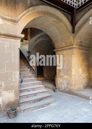 Staircase with wooden balustrade leading to an old abandoned historic ...