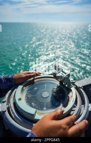 Compass on a military ship sailing on the sea Stock Photo - Alamy