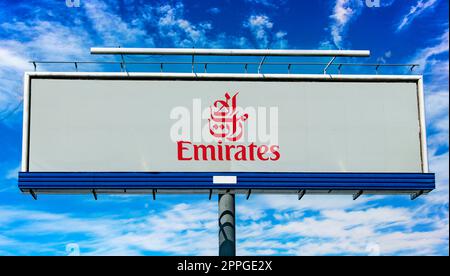 Advertisement billboard displaying logo of Emirates Stock Photo - Alamy