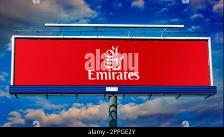 Advertisement billboard displaying logo of Emirates Stock Photo - Alamy