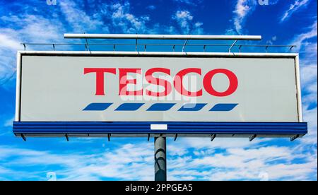 Advertisement billboard displaying logo of Tesco Stock Photo - Alamy