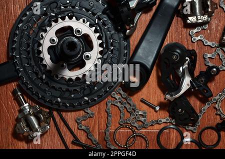 Many different metal parts and components of the running gear of a ...