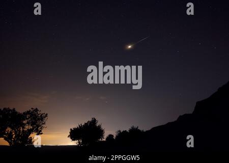 Beautiful view of shooting star in night sky Stock Photo - Alamy
