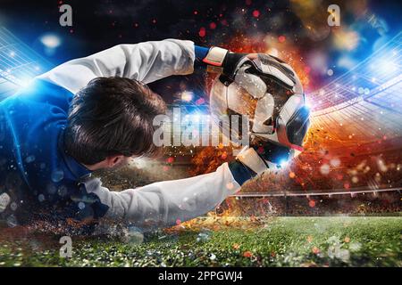 Goalkeeper catches a fast fiery soccer ball Stock Photo - Alamy