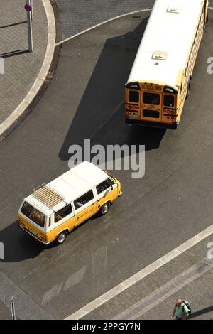 Aerial view of american yellow school bus picking up children at ...