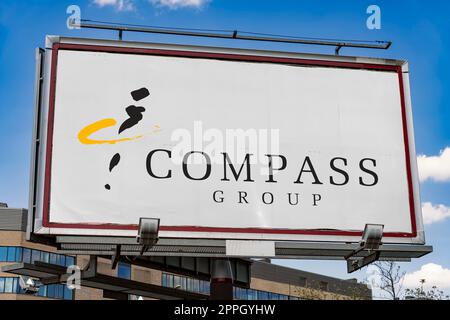 Advertisement billboard displaying logo of Compass Group Stock Photo ...