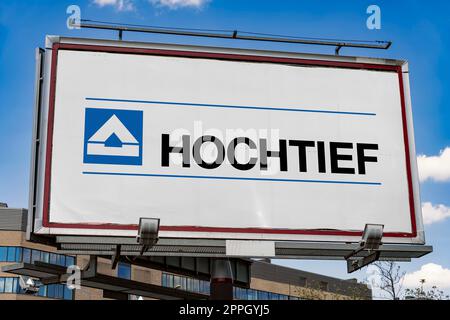 Advertisement billboard displaying logo of Hochtief Stock Photo - Alamy