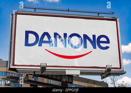 Advertisement billboard displaying logo of Danone Stock Photo - Alamy