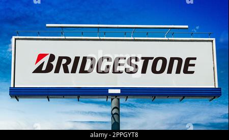 Advertisement billboard displaying logo of Bridgestone Stock Photo - Alamy