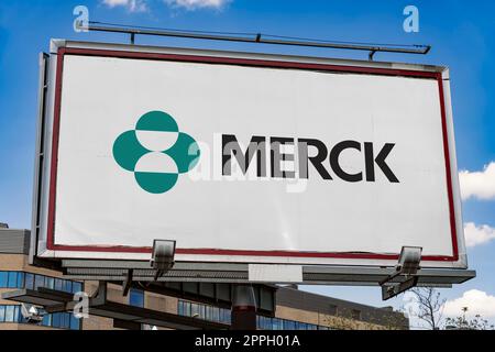 Advertisement billboard displaying logo of Merck Stock Photo - Alamy