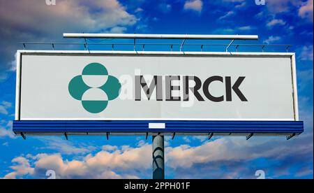 Advertisement billboard displaying logo of Merck Stock Photo - Alamy