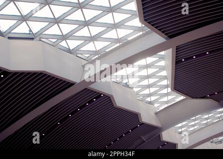 Large, modern design glass skylight at an airport. The beams form ...