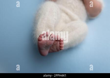 twisted child. Soft feet of a newborn Stock Photo - Alamy