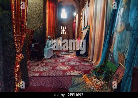 Ethiopian monk inside a rock-hewn church, Amhara Region, Lalibela ...