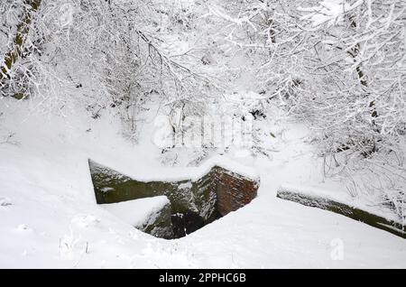 Underground bunker of old brick walls in winter after snowfall Stock ...