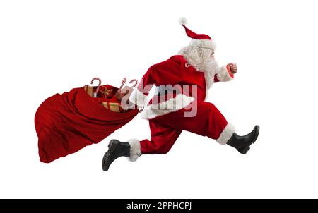 santa claus runs fast to deliver all gifts for christmas Stock Photo ...