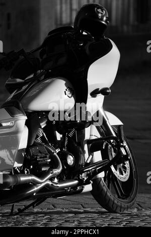 Vertical grayscale of a white chopper motorcycle. Harley Davidon in ...