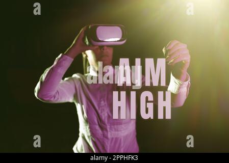 Hand writing sign Aim High. Conceptual photo go for best job school or ...