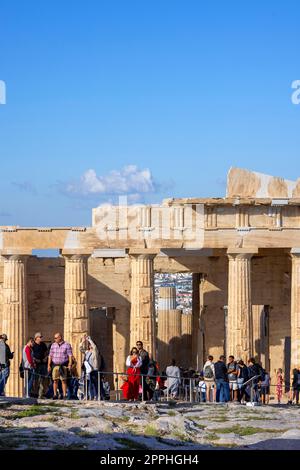 Group of tourists in front of Propylaia, monumental ceremonial gateway to the Acropolis of ...