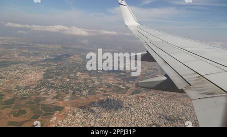 Wing of an airplane flying over Israel, Passenger s view. Looking ...
