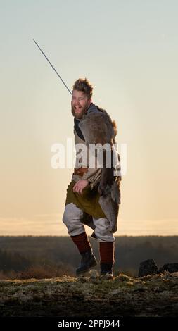 Viking attacking with sword Stock Photo - Alamy