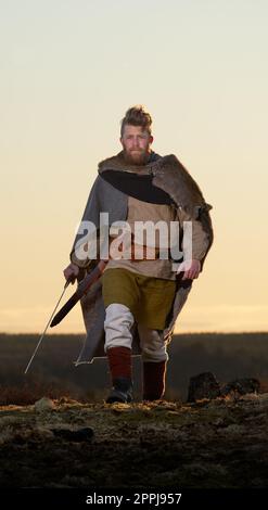 Viking attacking with sword Stock Photo - Alamy