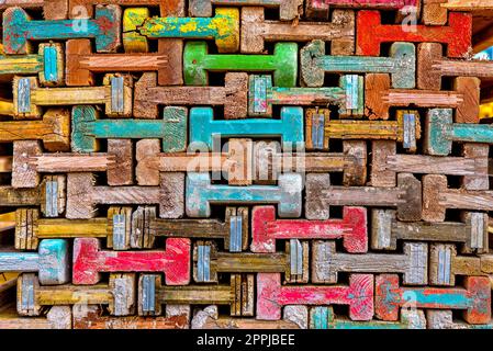 Close up of colorful stacked h-shaped wooden struts for concrete ...