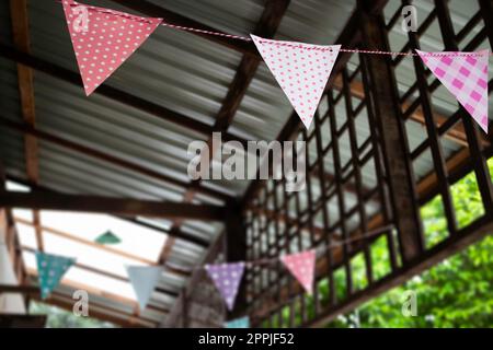Festive colorful flags decorated on wooden architecture, stock photo ...