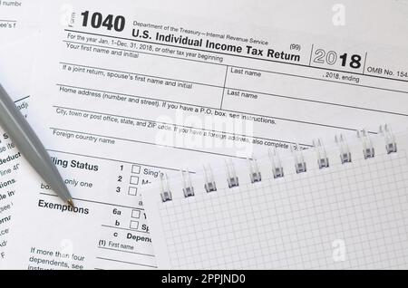 Tax forms 1040. U.S Individual Income Tax Return with clock and ...