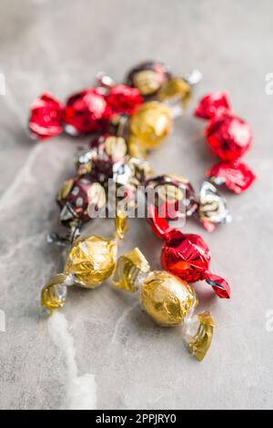 Hard sugar candy sweet wrapped in blue cellophane Stock Photo - Alamy