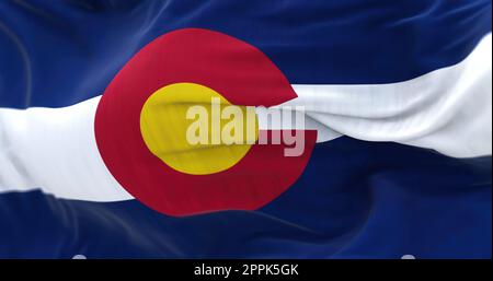 waving flag State of Colorado close up against blue sky Stock Photo - Alamy