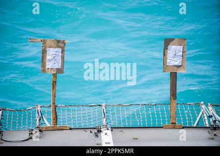 Paper shooting targets on a pole Stock Photo - Alamy