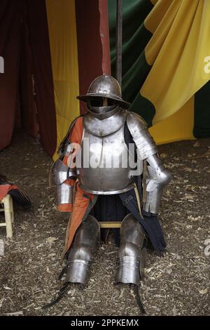 Medieval armor, detail of an ancient armor. Steel gloves on wooden ...