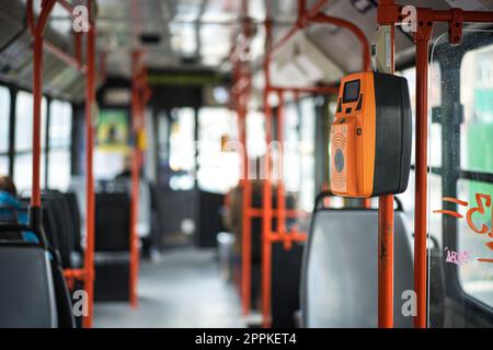 Ticket validator inside a public transportation bus Stock Photo - Alamy