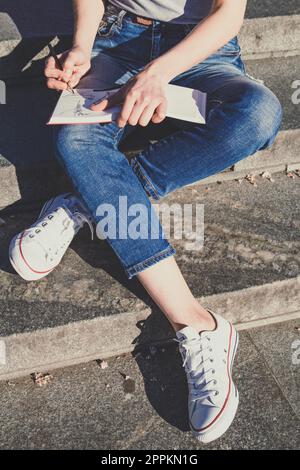 Closeup image of creative woman drawing fashion sketches on digital ...