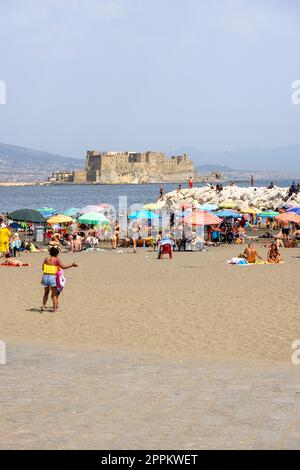 People relaxing on the Mappatella Beach by the Tyrrhenian Sea, colorful ...